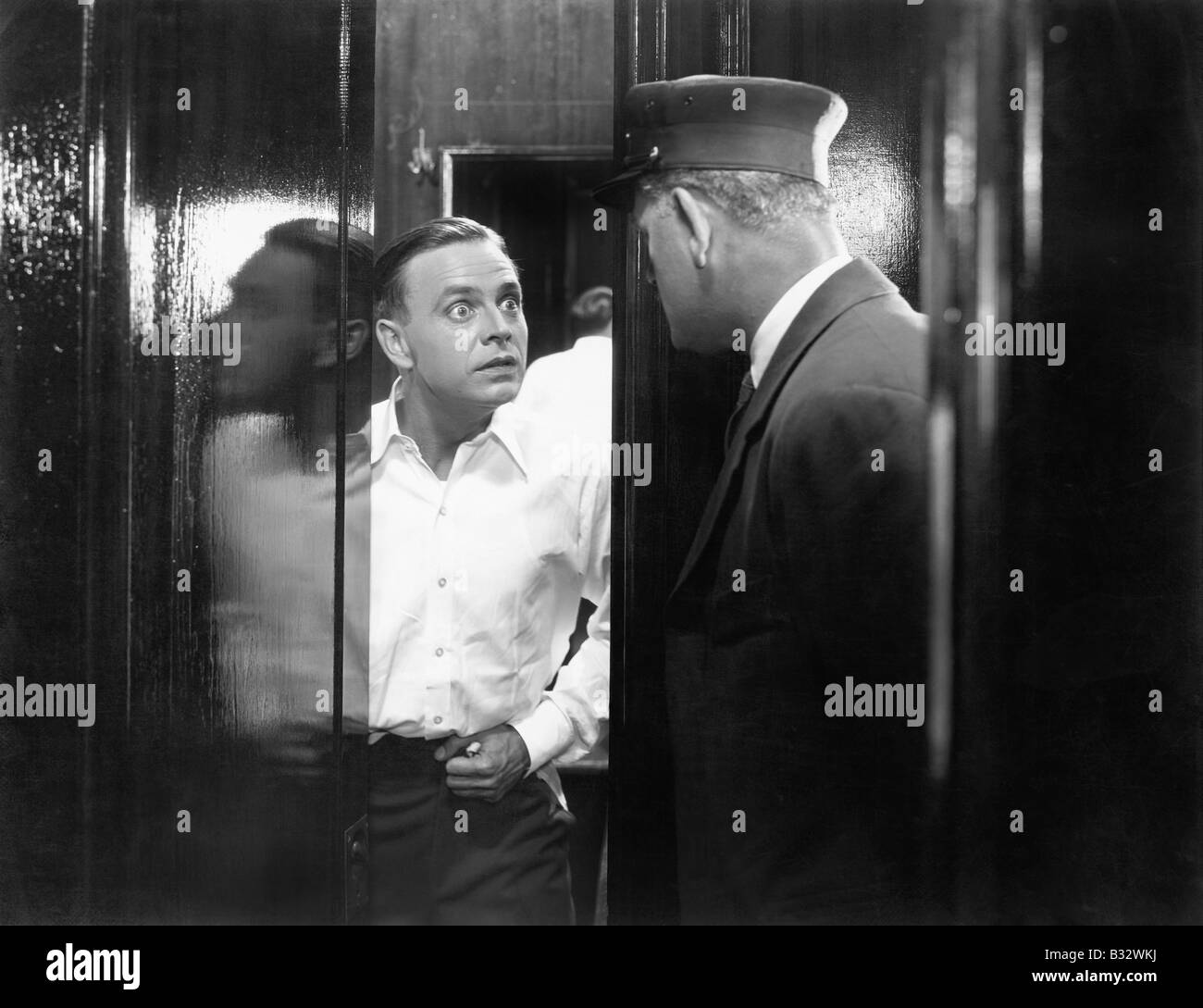 Man opening door looking shocked hi-res stock photography and images ...
