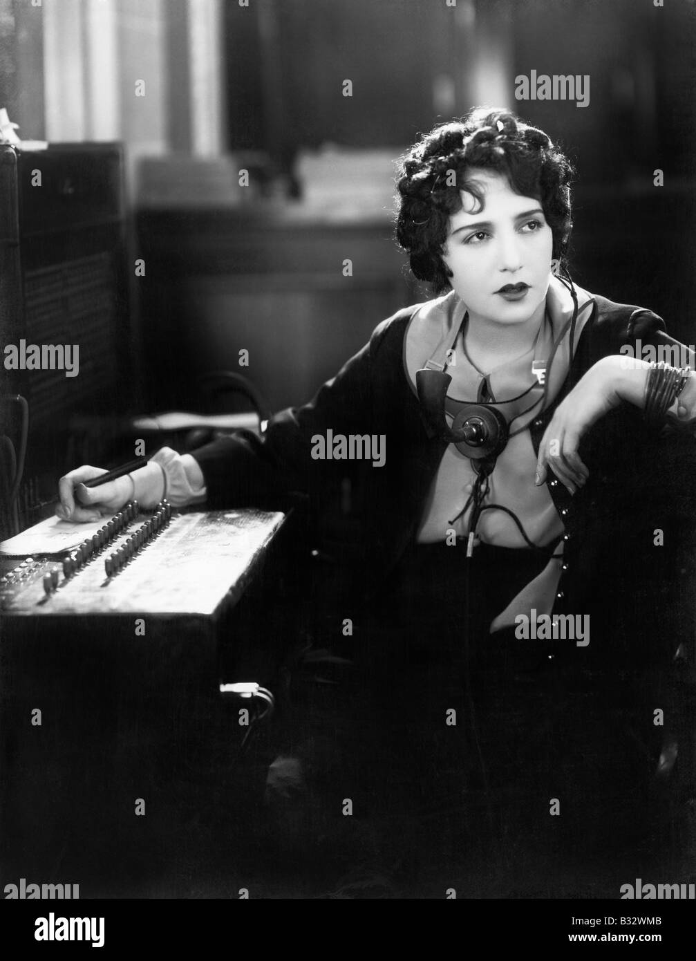 Young woman working as a telephone operator Stock Photo - Alamy
