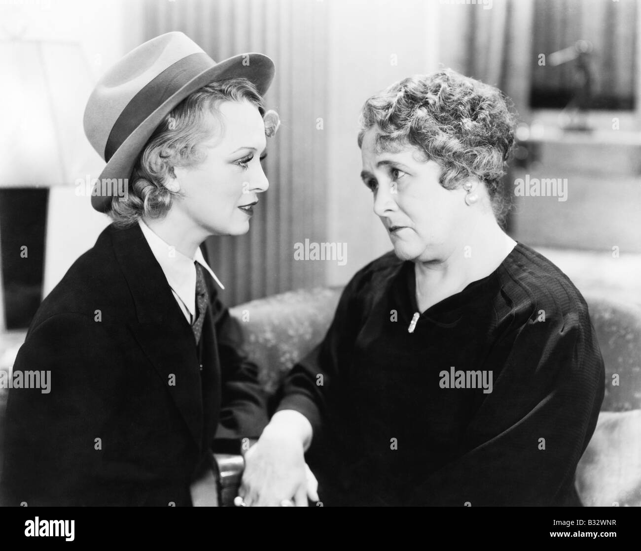 Two people 20s talking one sad hi-res stock photography and images - Alamy