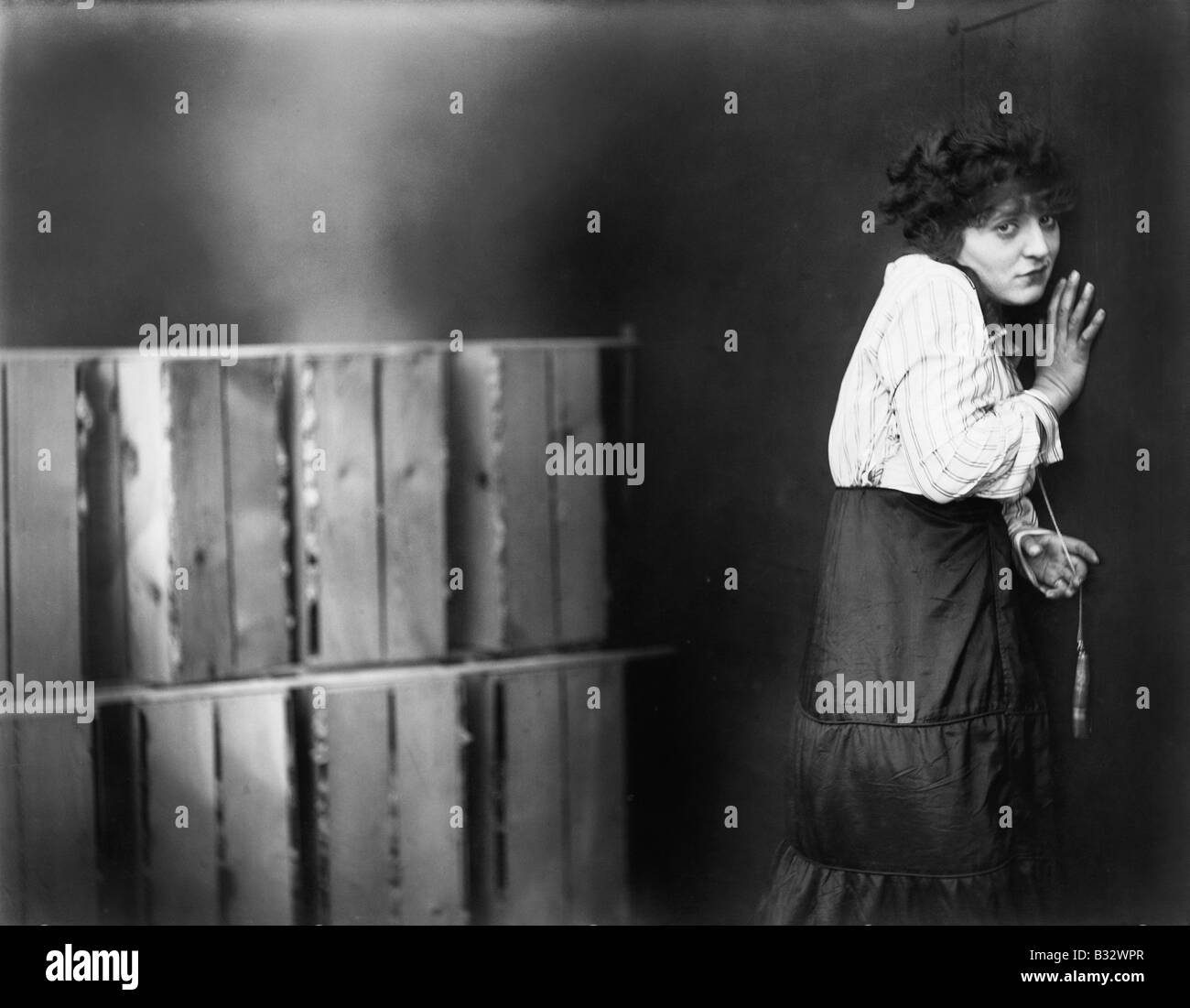 Young woman turning away and looking scared Stock Photo - Alamy