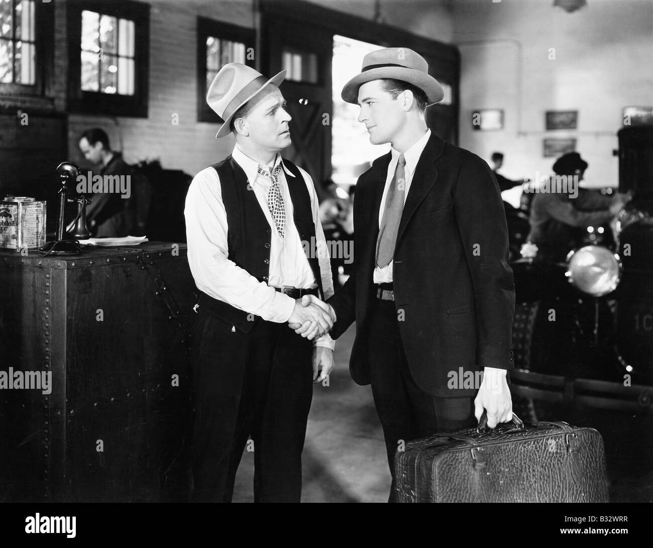 Hands two men in Black and White Stock Photos & Images - Alamy