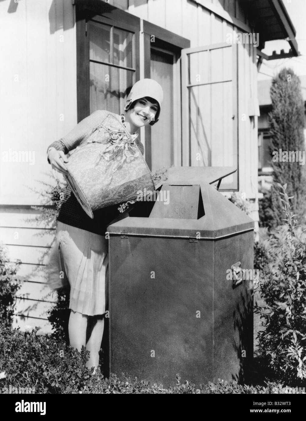 Retro woman garbage can hi-res stock photography and images - Alamy