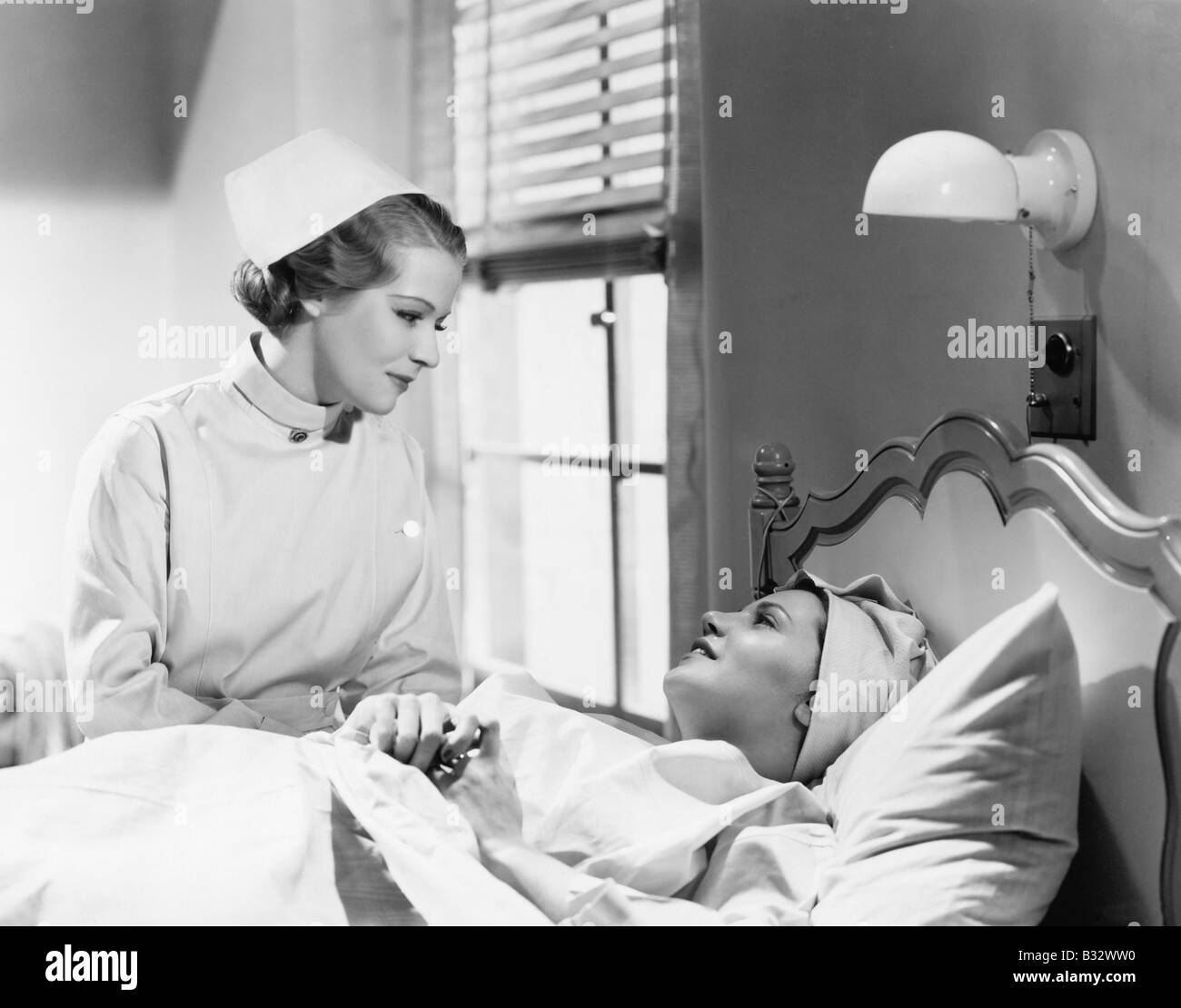 Nurses talking to each other Black and White Stock Photos & Images - Alamy