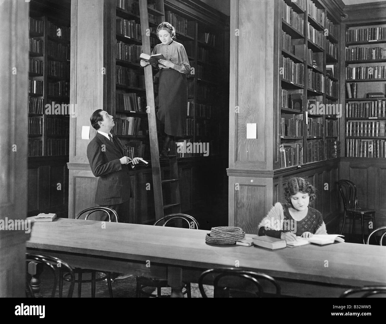 Library man ladder hi-res stock photography and images - Alamy