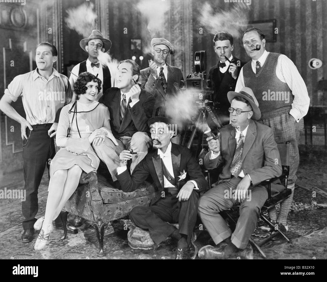 Group of people sitting in a living room smoking Stock Photo - Alamy
