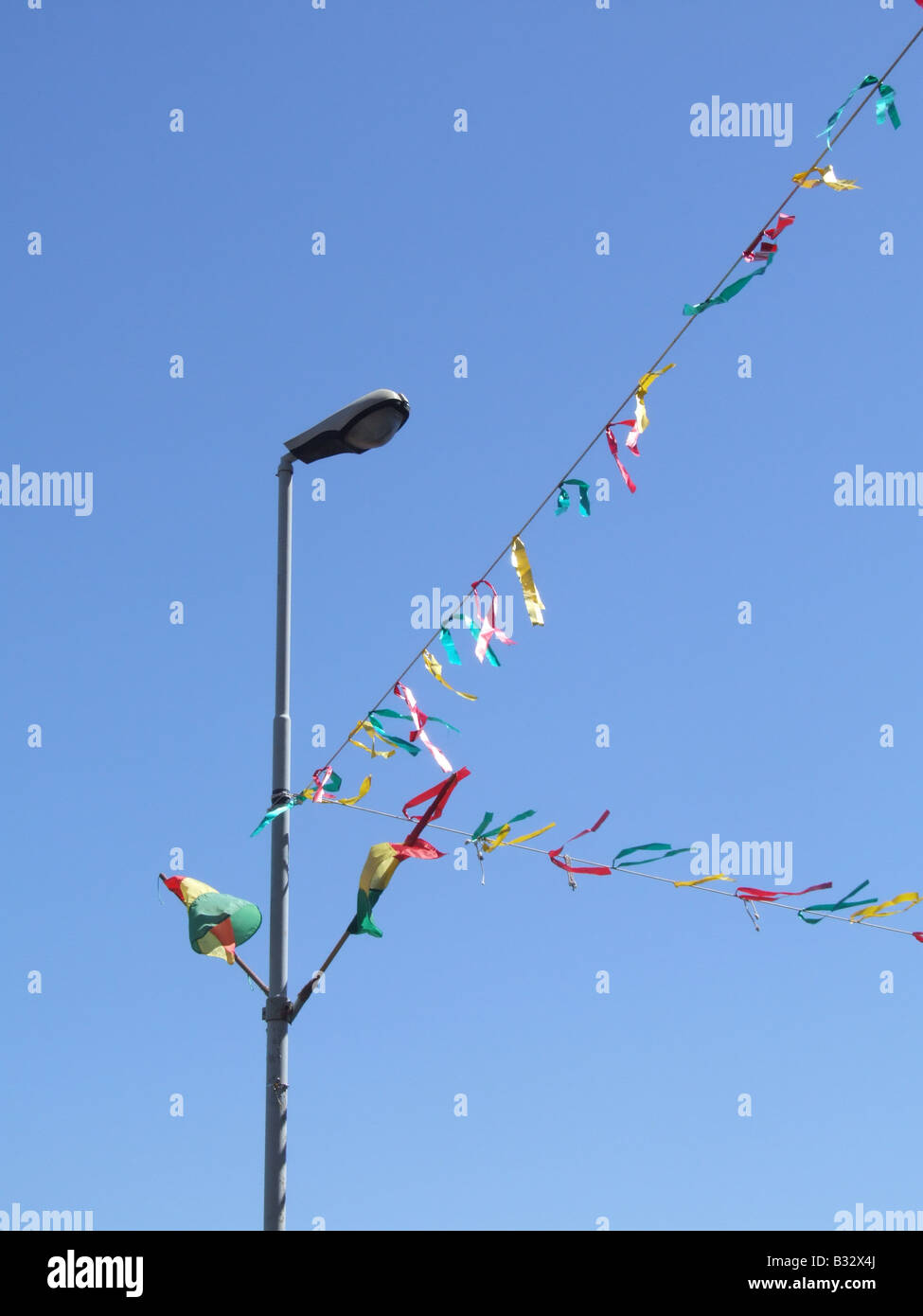 colourful carnival bunting decorations in blue sky Stock Photo - Alamy