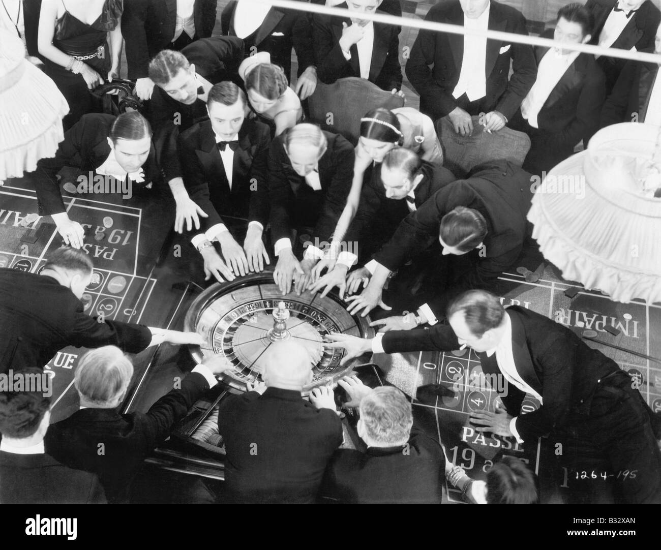High angle of a group of people playing roulette Stock Photo - Alamy