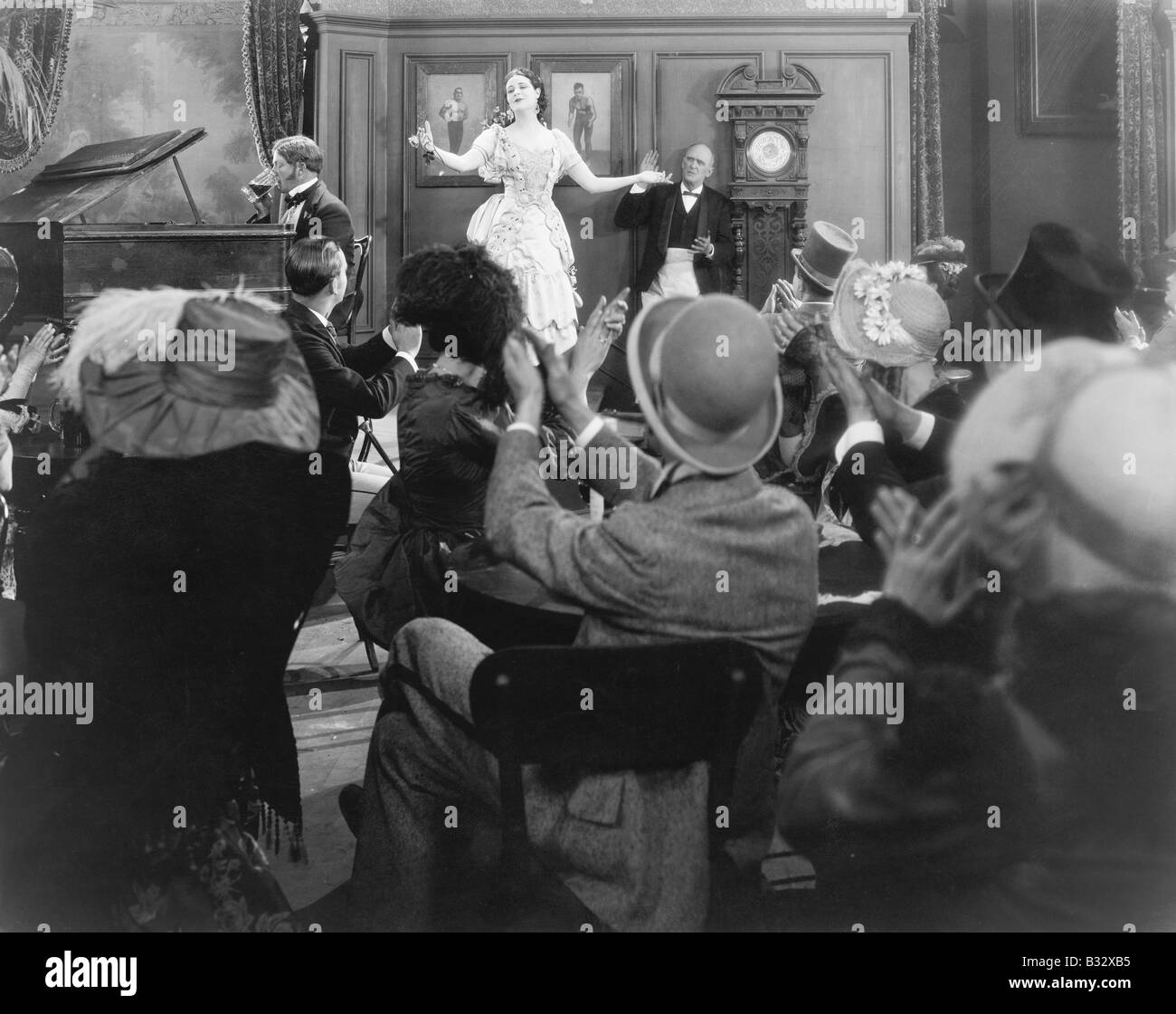 Young woman performing for a group of spectators Stock Photo - Alamy