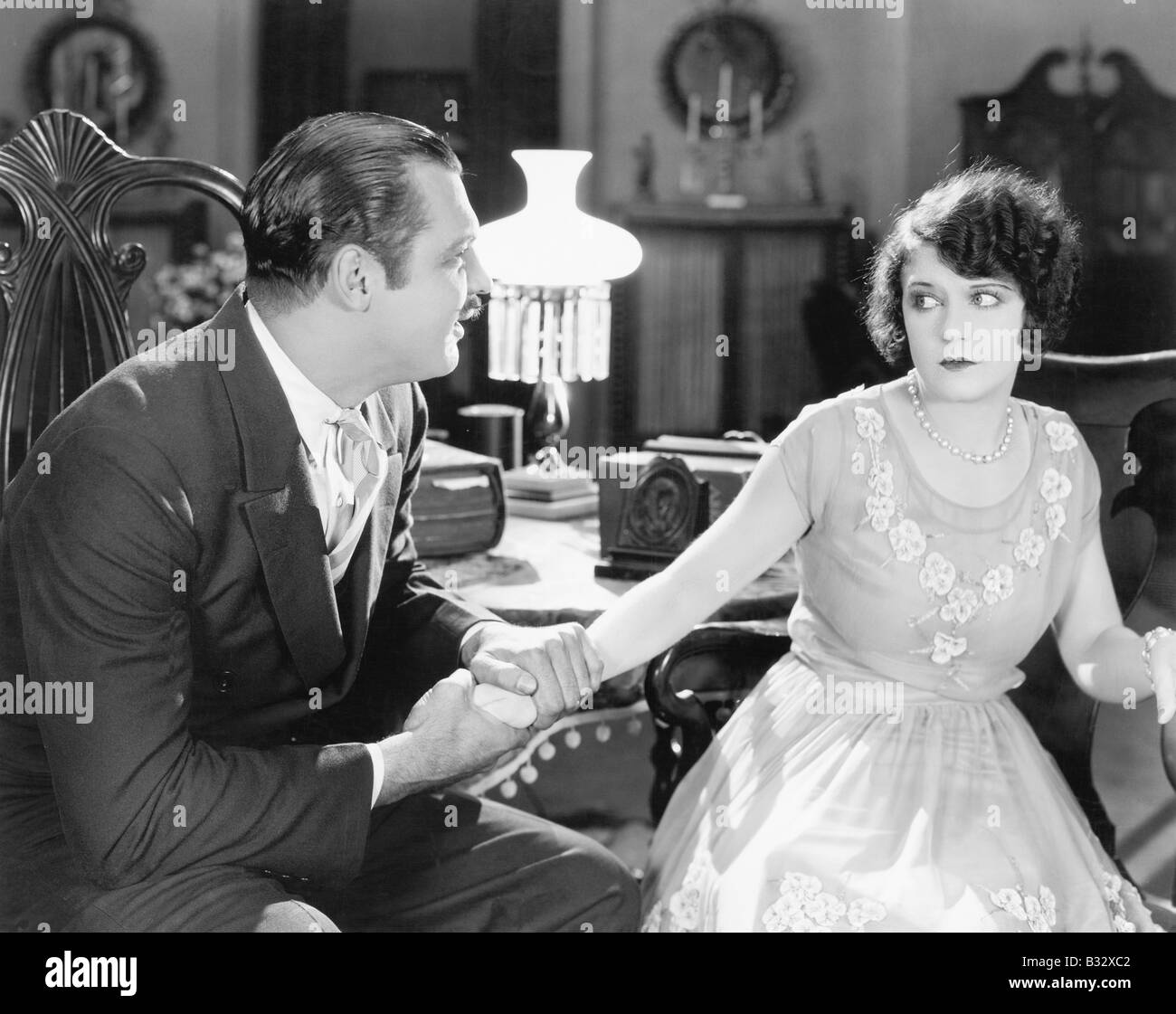 Woman trying to pull away from a man Stock Photo - Alamy