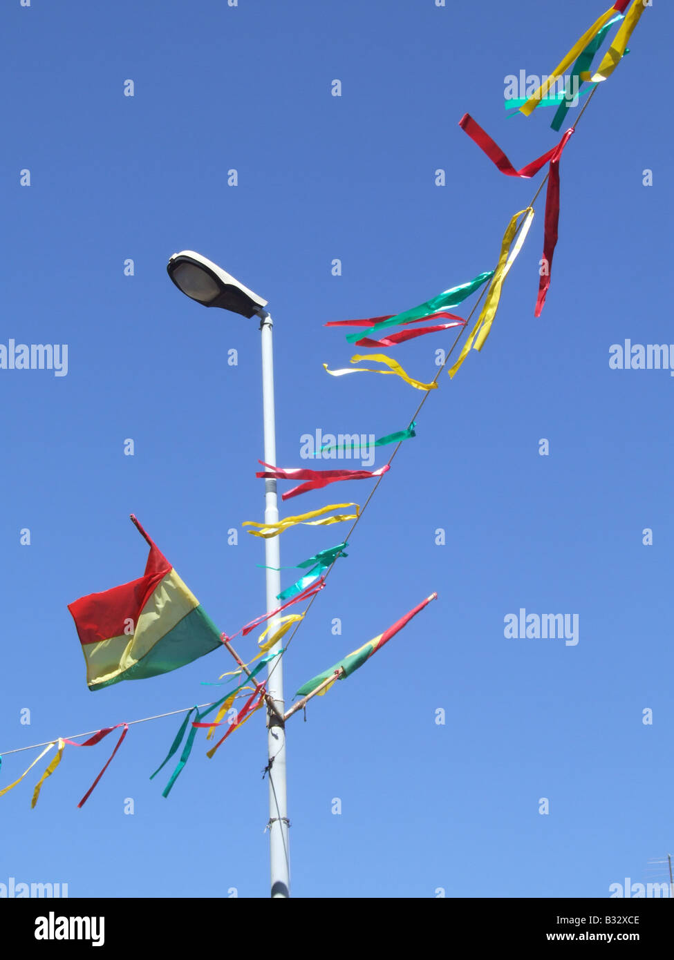 colourful carnival bunting decorations in blue sky Stock Photo - Alamy