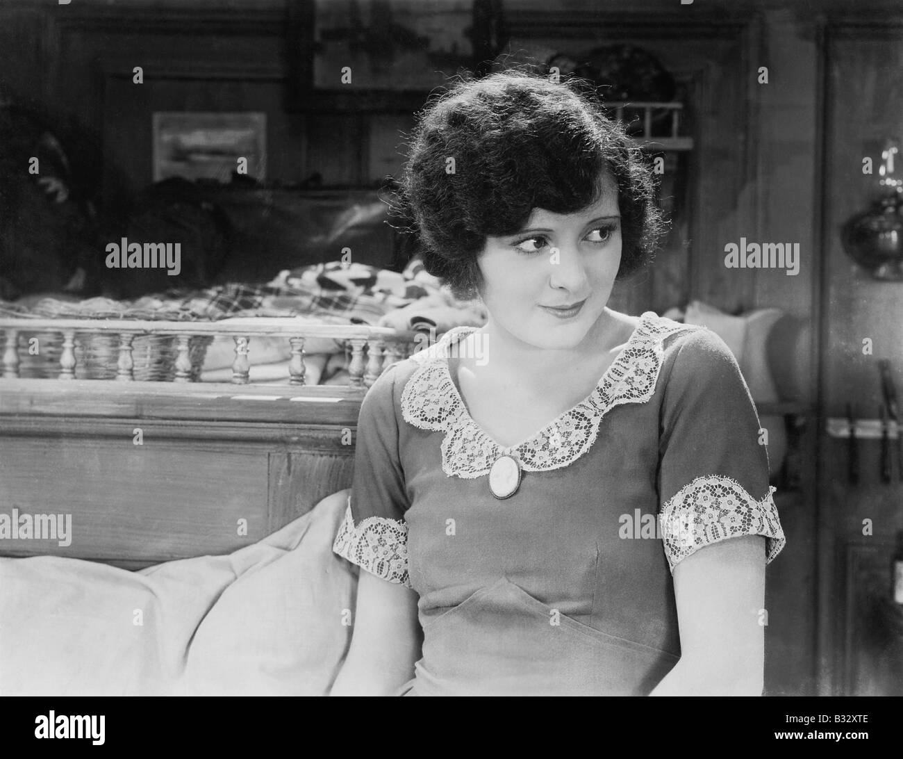 Woman looking coy Stock Photo - Alamy