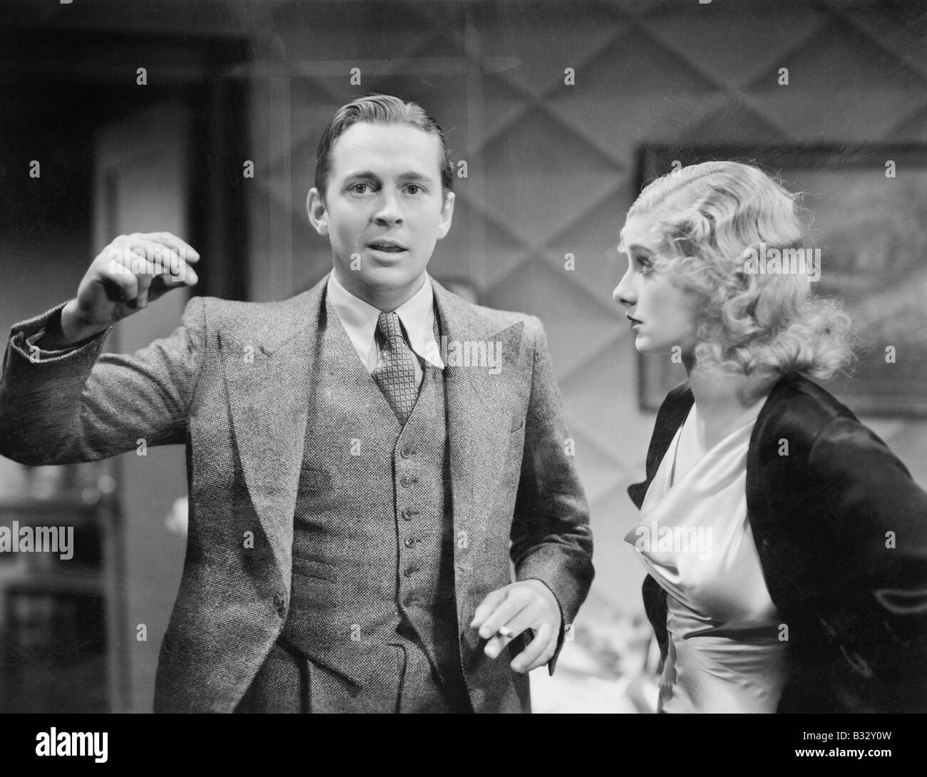 Man trying to explain something to a young woman who is listening Stock ...