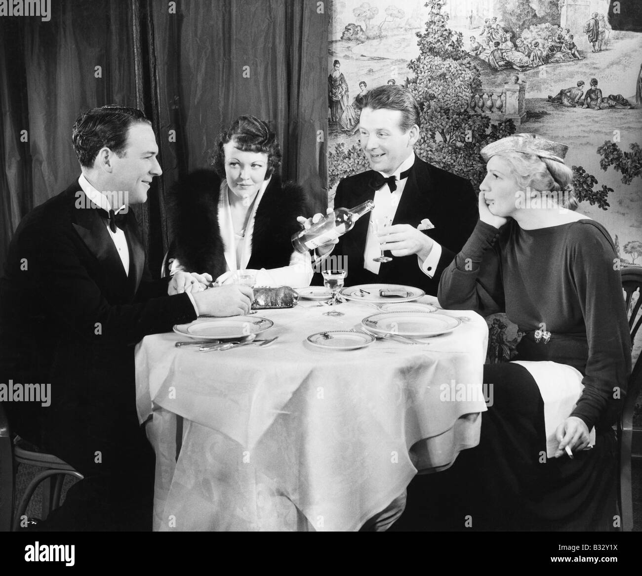 Restaurant dinner with friends Black and White Stock Photos & Images ...