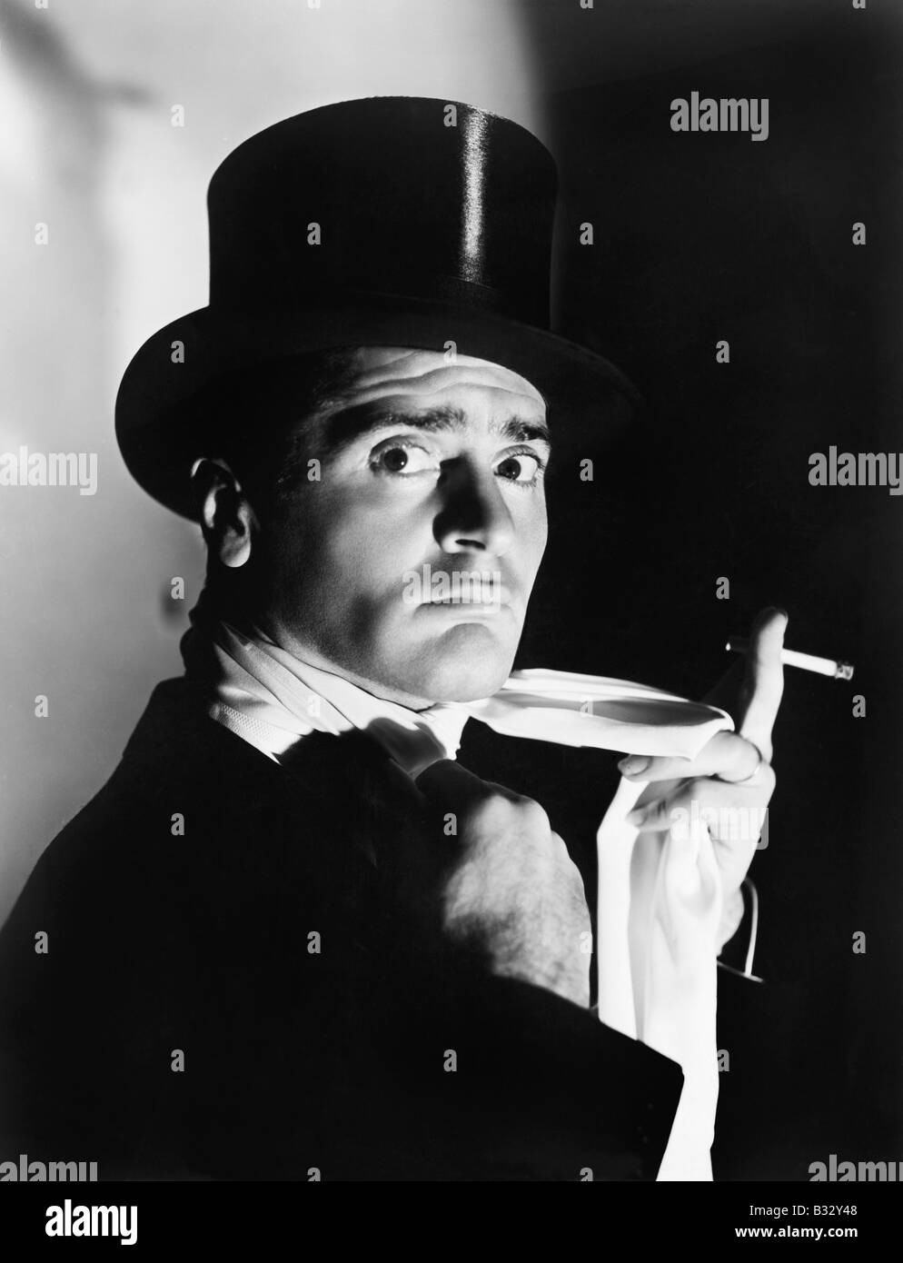 Top hat looking Black and White Stock Photos & Images - Alamy