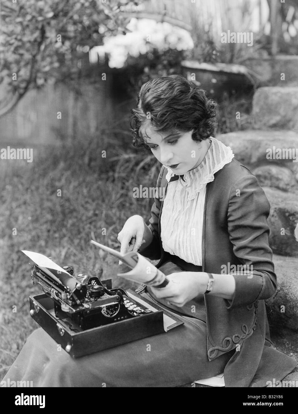 Woman typing on a typewriter hi-res stock photography and images - Alamy