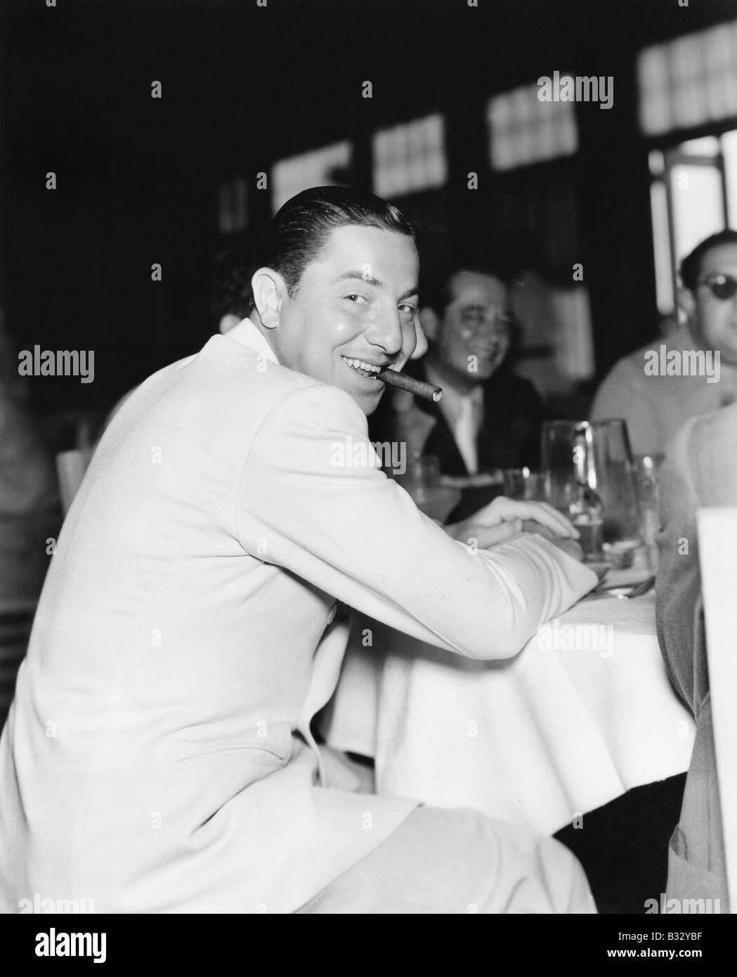 Smiling and smoking cigar Black and White Stock Photos & Images - Alamy