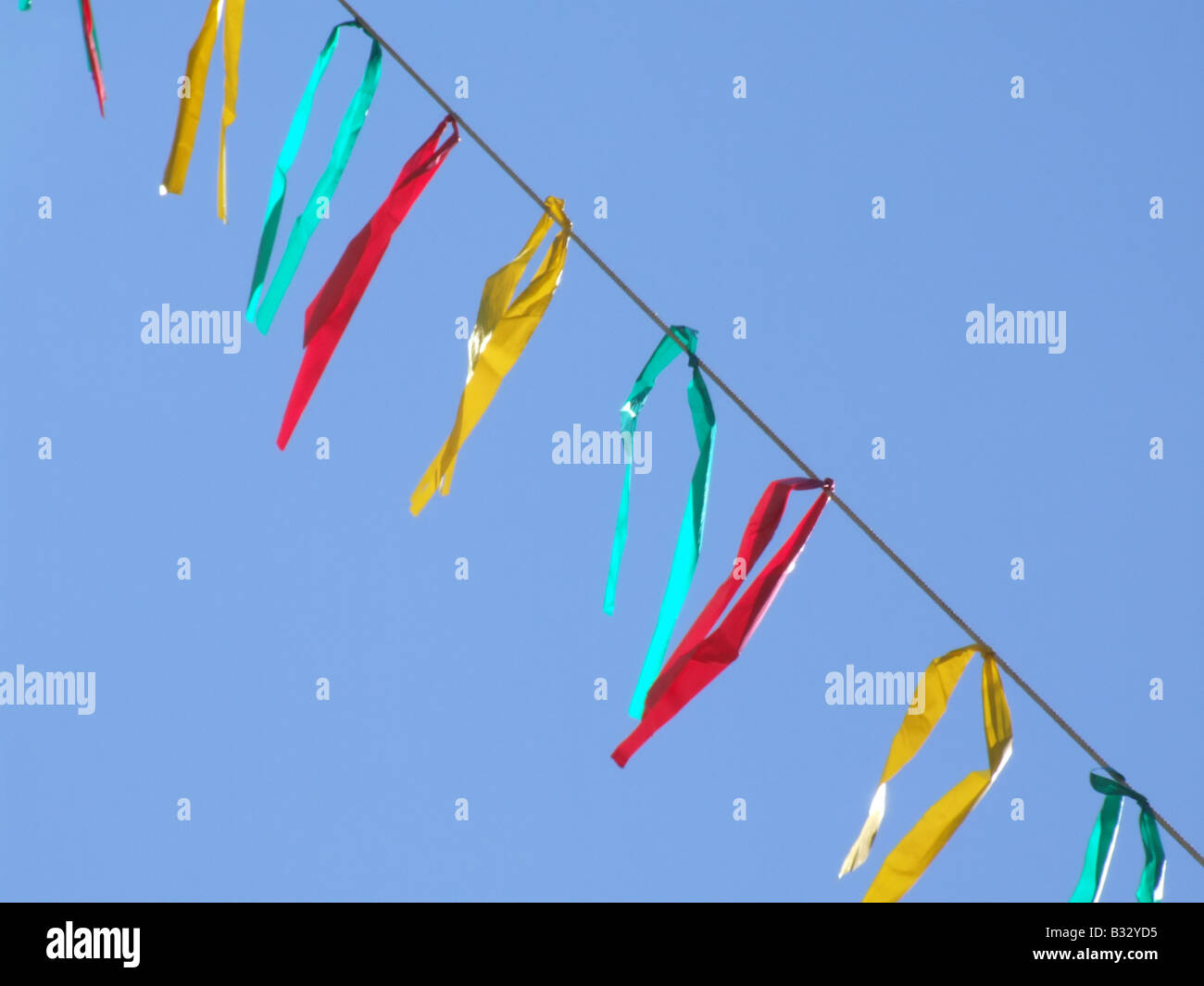 colourful carnival bunting decorations in blue sky Stock Photo - Alamy