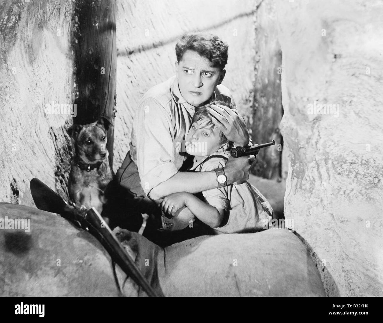 Father protecting his son with a gun in hand Stock Photo - Alamy