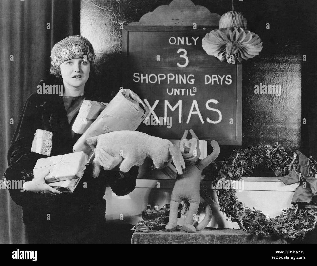 Female shopper and sign with number of shopping days until Christmas ...