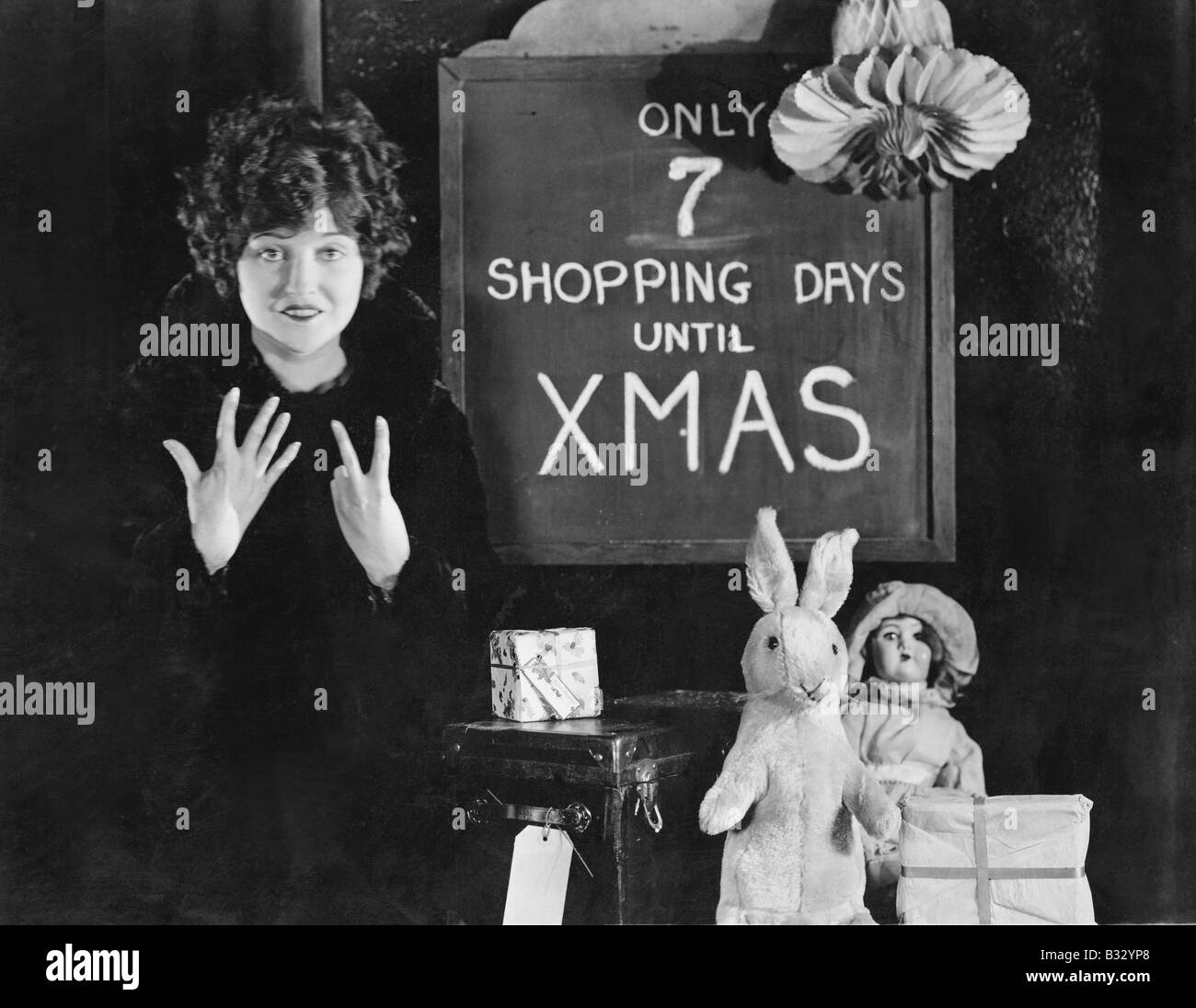 Woman and sign with number of shopping days until Christmas Stock Photo ...
