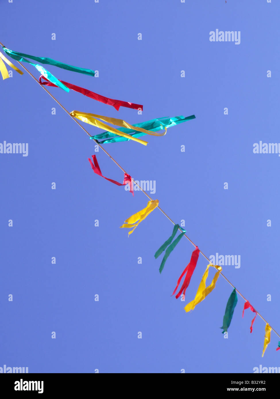 colourful carnival bunting decorations in blue sky Stock Photo - Alamy