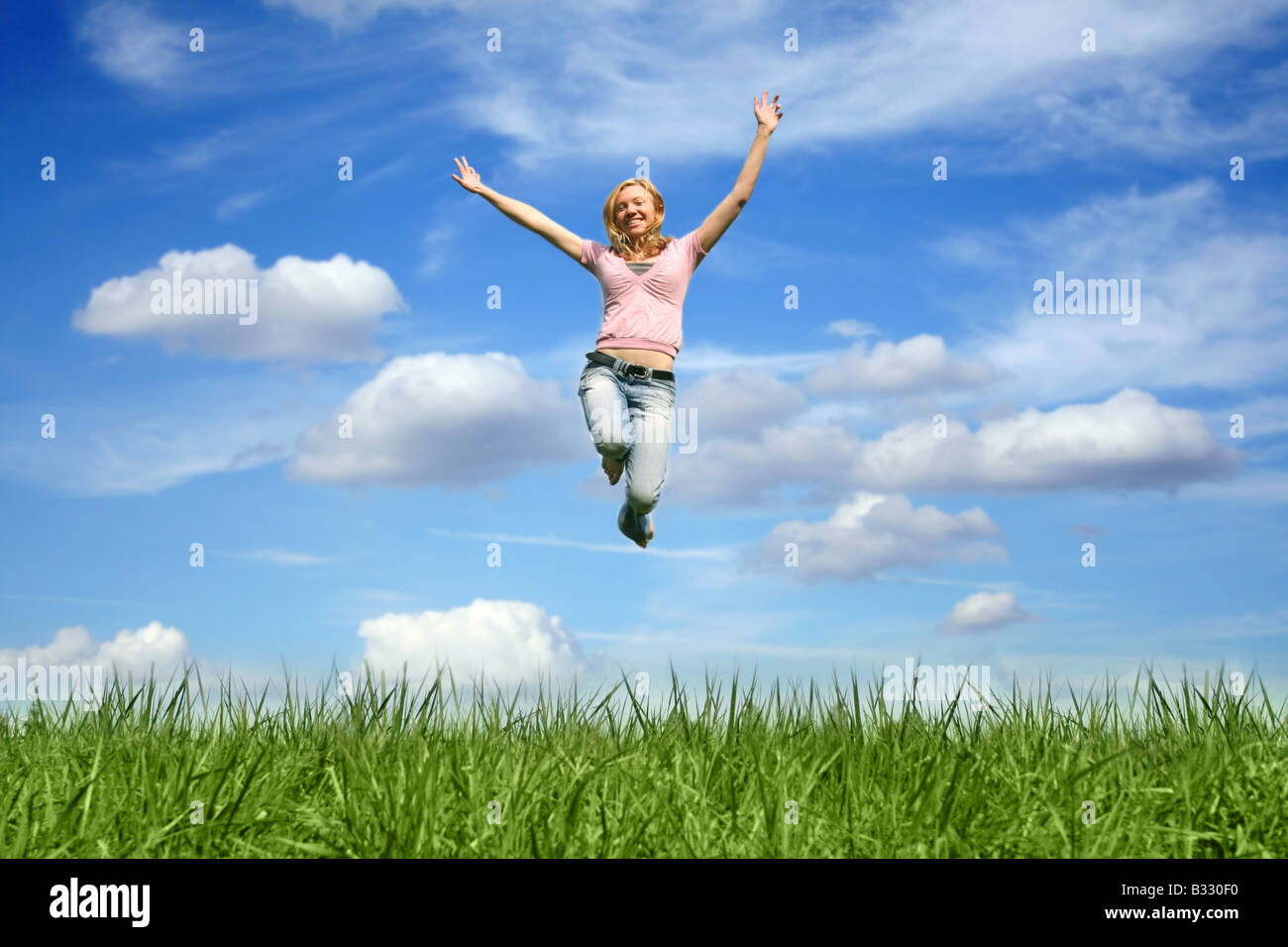 Woman makes air jump Stock Photo - Alamy