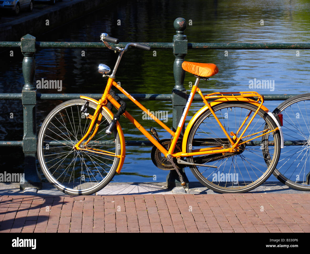Dutch bicycle at a canal in Amsterdam Stock Photo - Alamy