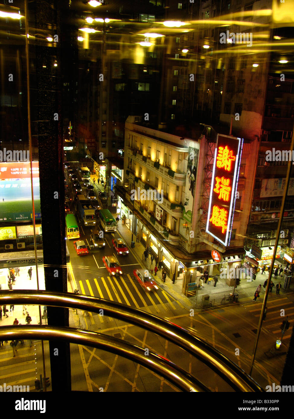 View from a modern glaselevator at Kowloons Nathan Road by night ...