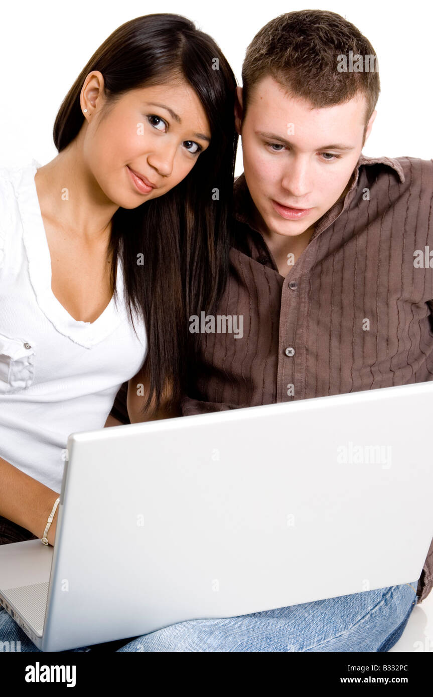 A young couple using a computer together Stock Photo - Alamy