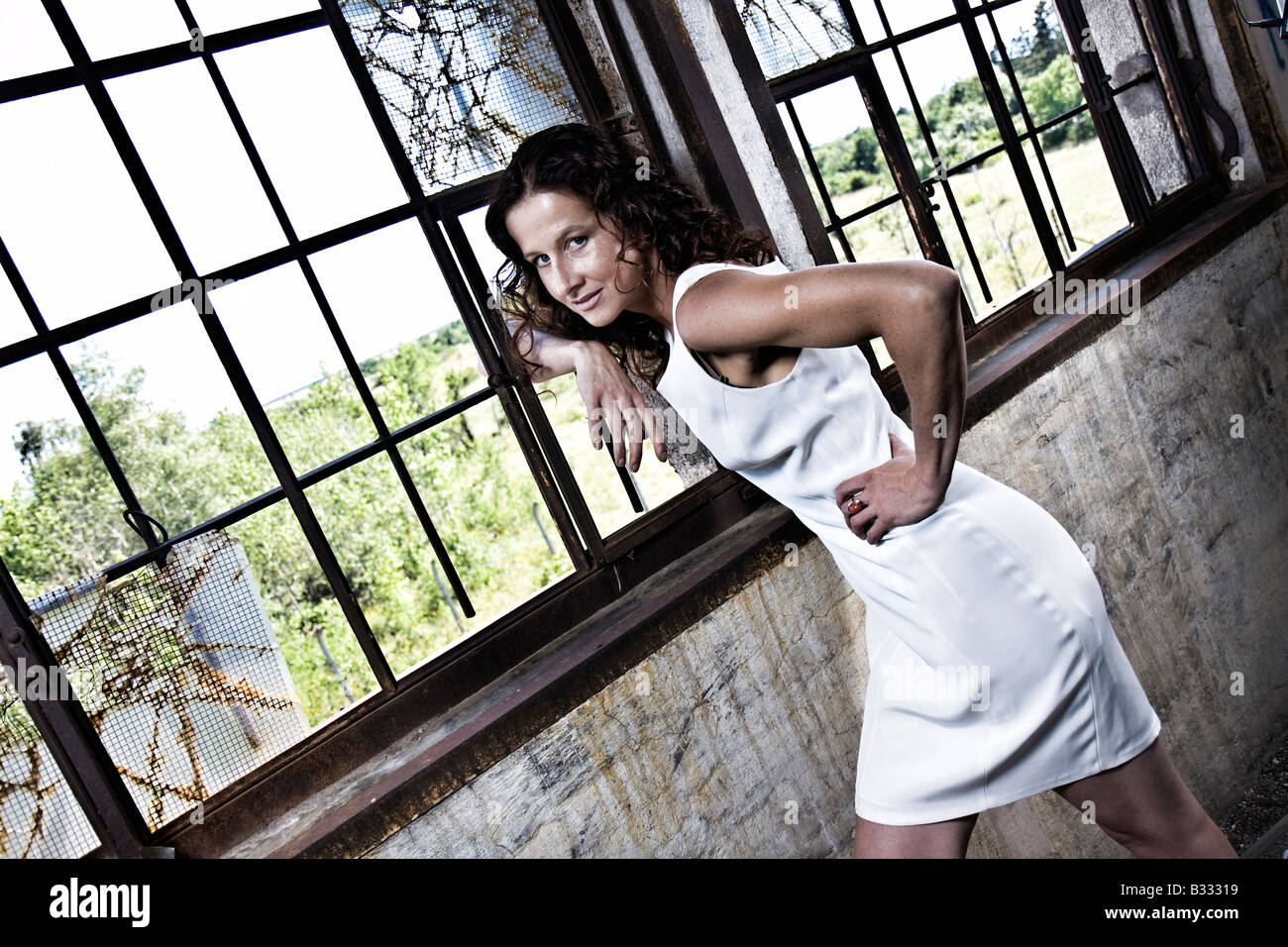 young woman posing at window Stock Photo - Alamy