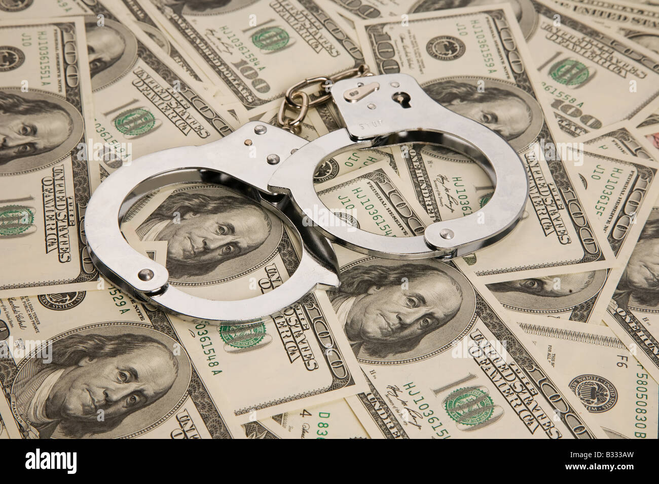Dollar banknotes and handcuffs Stock Photo - Alamy
