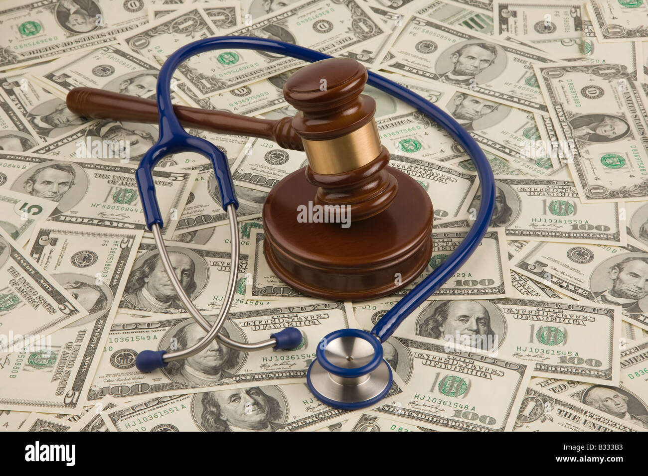 Dollars bills and a judge hammer hi-res stock photography and images ...