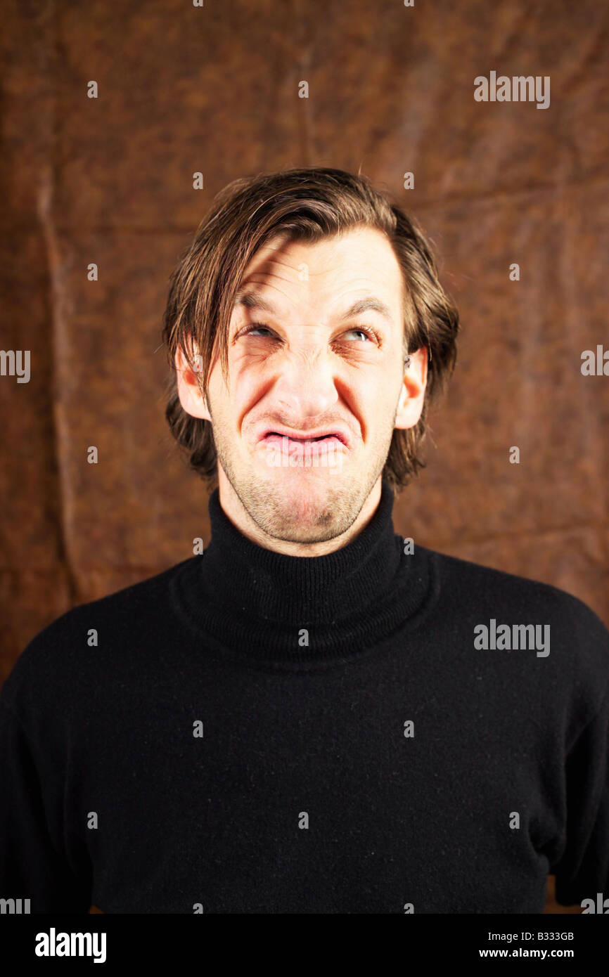 a young man making a face, portrait Stock Photo - Alamy