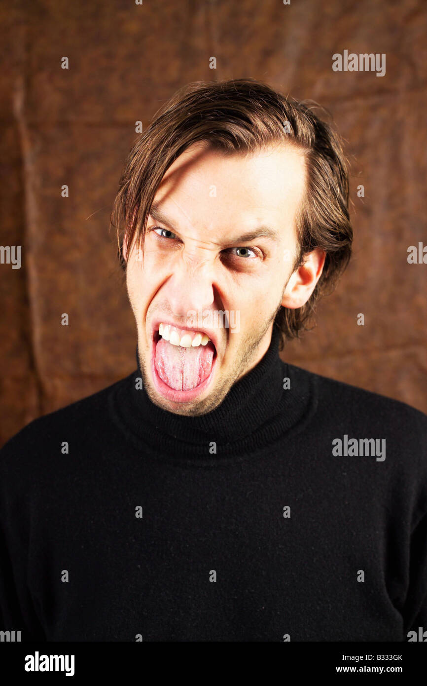 a young man making a face, portrait Stock Photo - Alamy