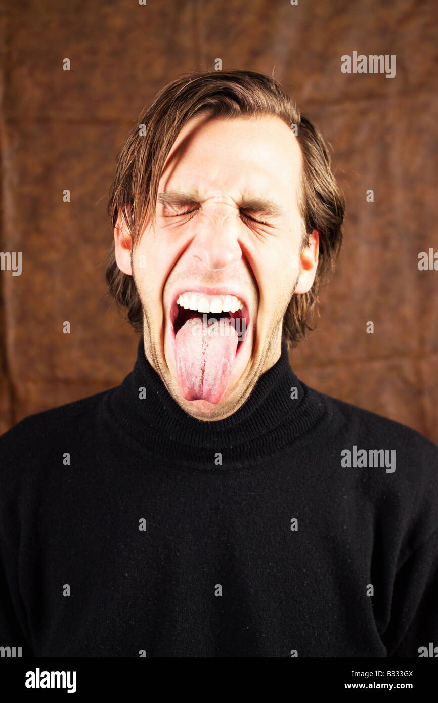 a young man making a face, portrait Stock Photo - Alamy