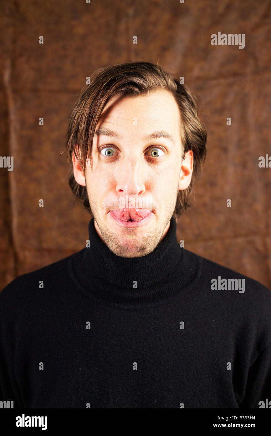 a young man making a face, portrait Stock Photo - Alamy