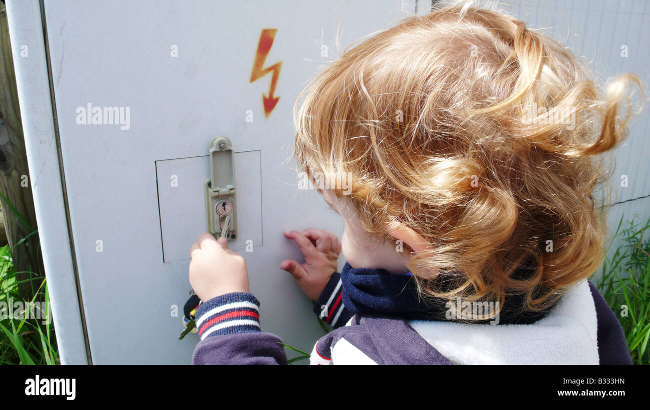 small boy playing at the electric transformer Stock Photo - Alamy