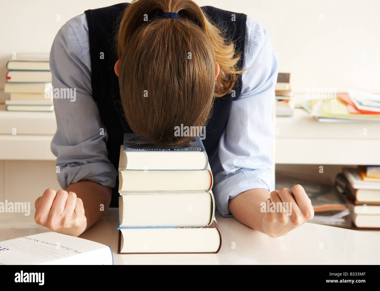 young woman being tired from learning Stock Photo - Alamy