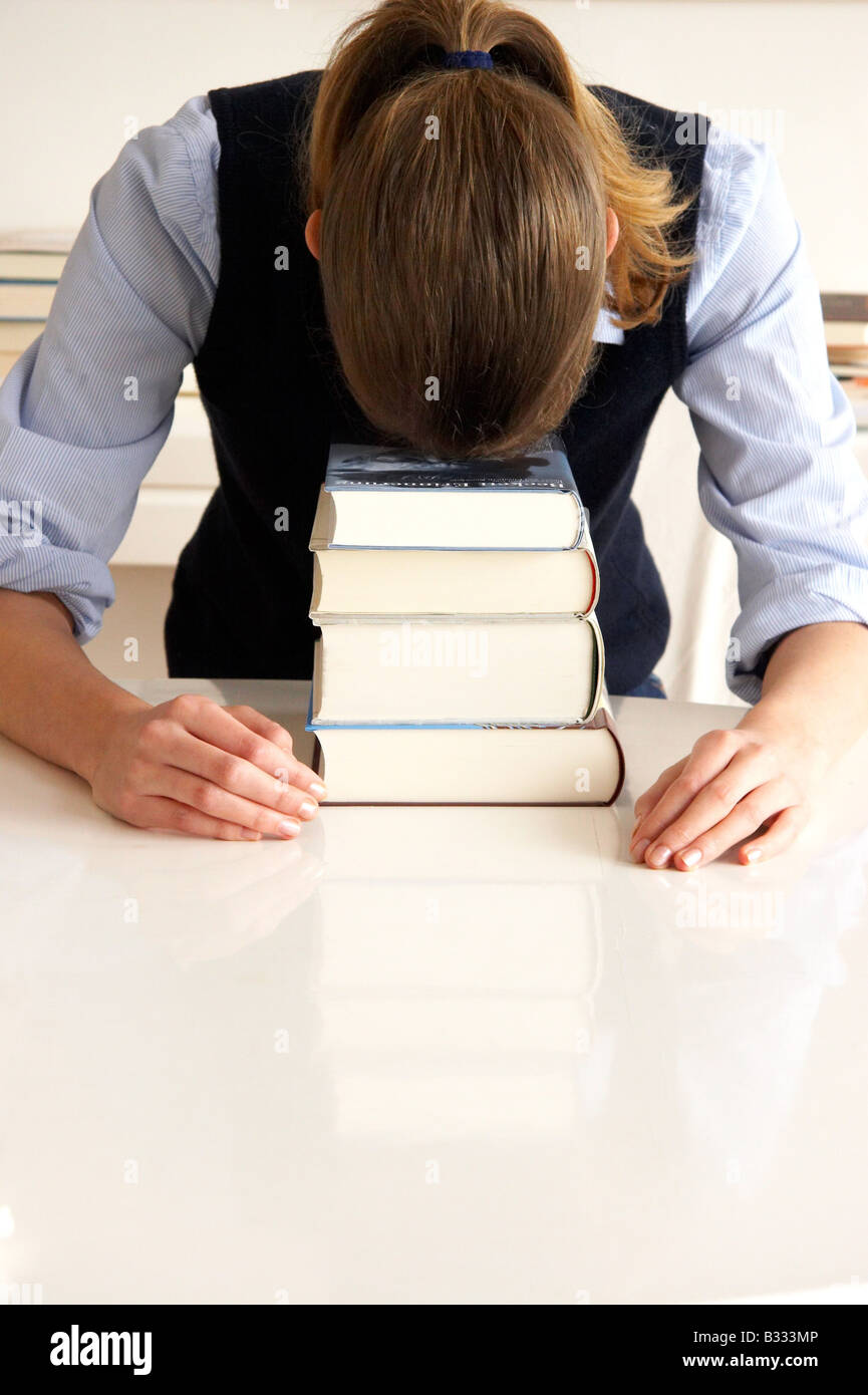young woman being tired from learning Stock Photo - Alamy
