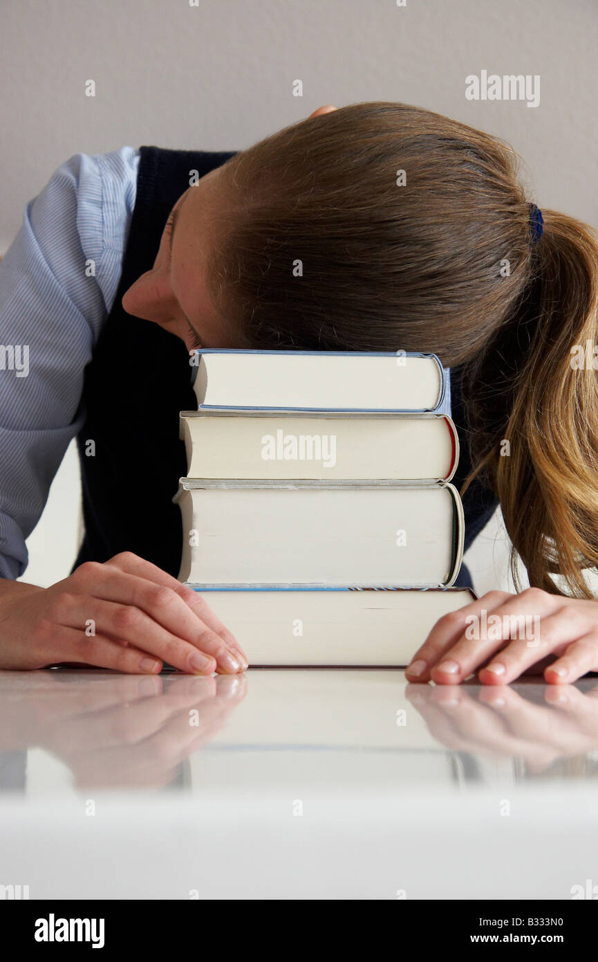 young woman being tired from learning Stock Photo - Alamy