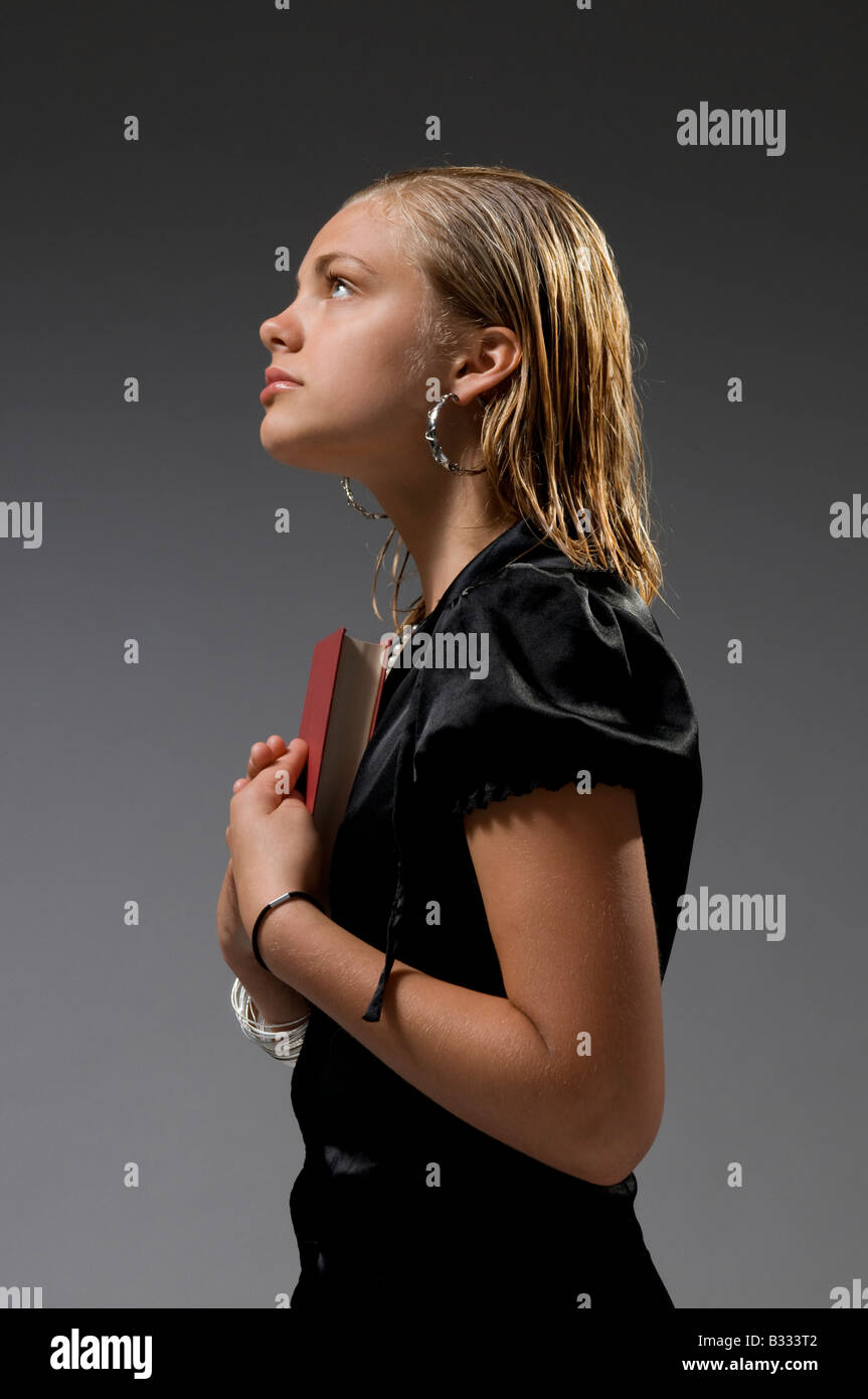 Blond woman with a red book Stock Photo - Alamy