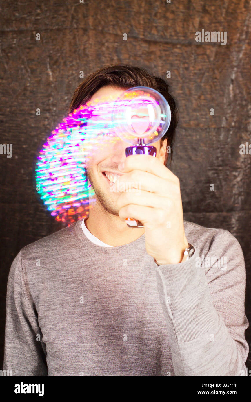 a young man with a luminous ball Stock Photo - Alamy