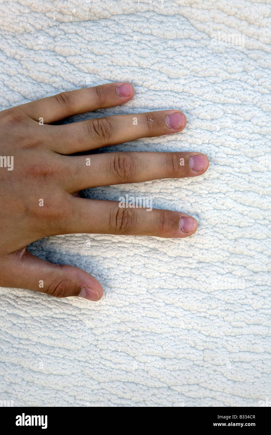 Hand touching surface of calcite terraces at Pamukalle Turkey Stock ...