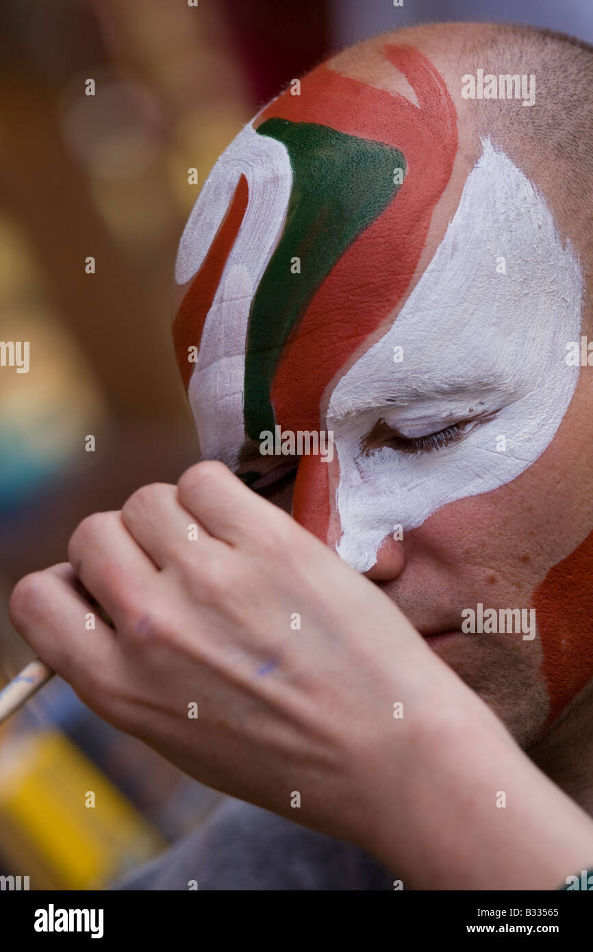 man lets paint his head with different colors Stock Photo - Alamy
