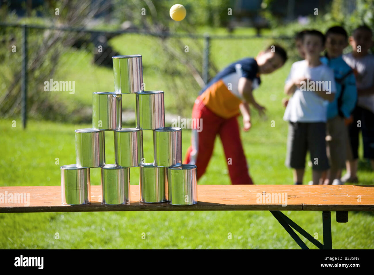 Children at throwing game Stock Photo - Alamy