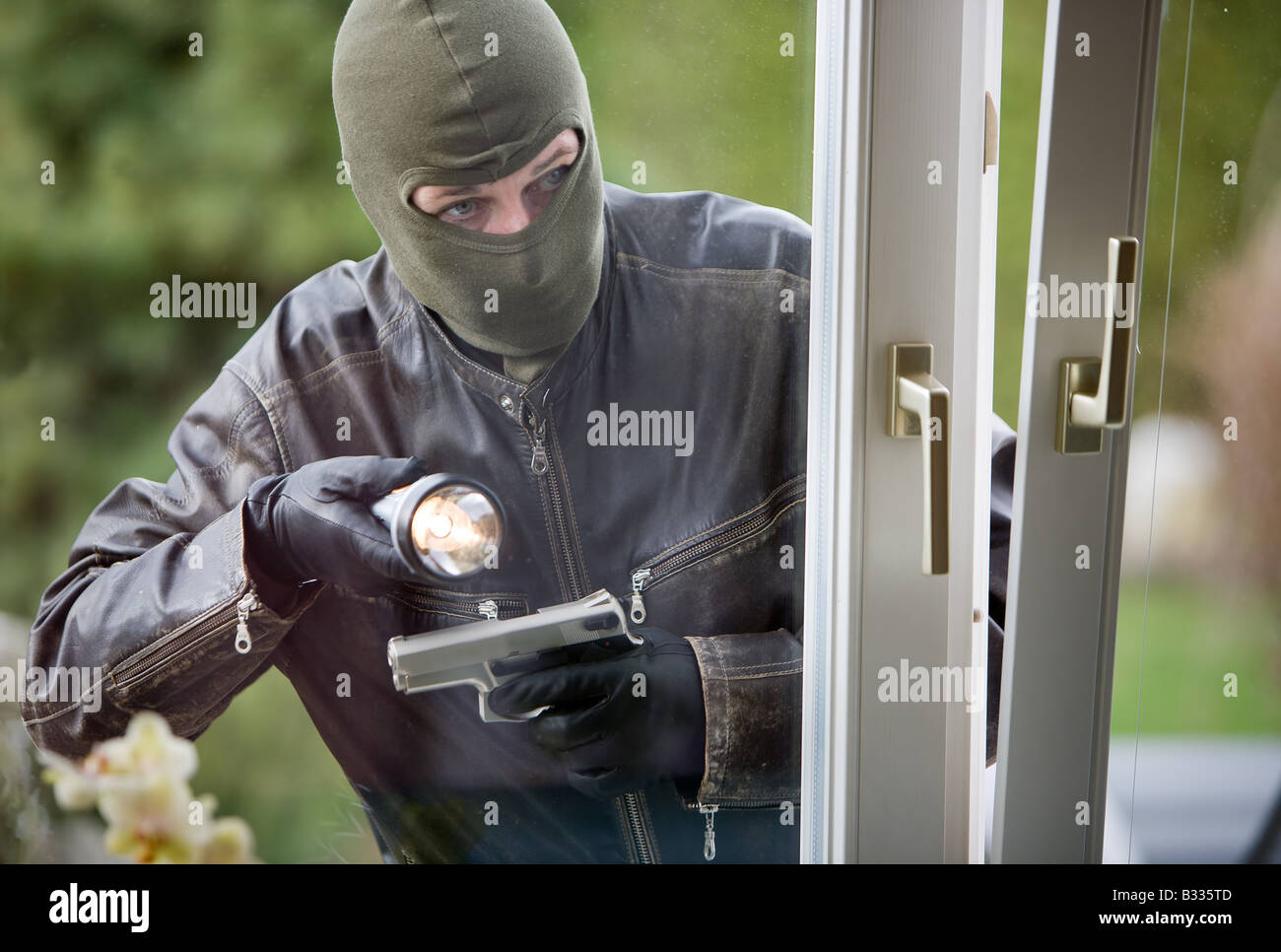 Burglar at a window Stock Photo - Alamy