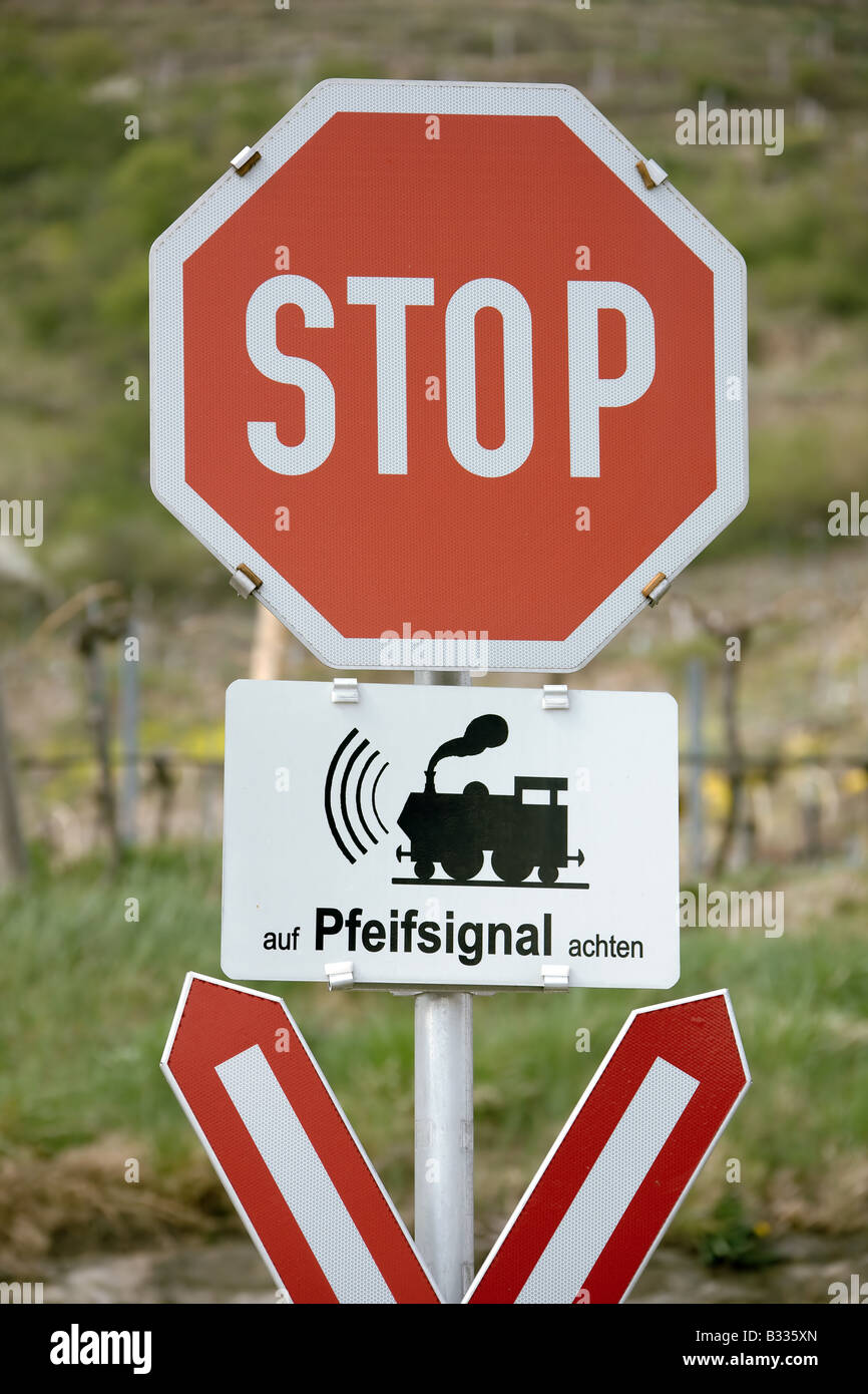 Stop sign at level crossing without barriers Stock Photo - Alamy