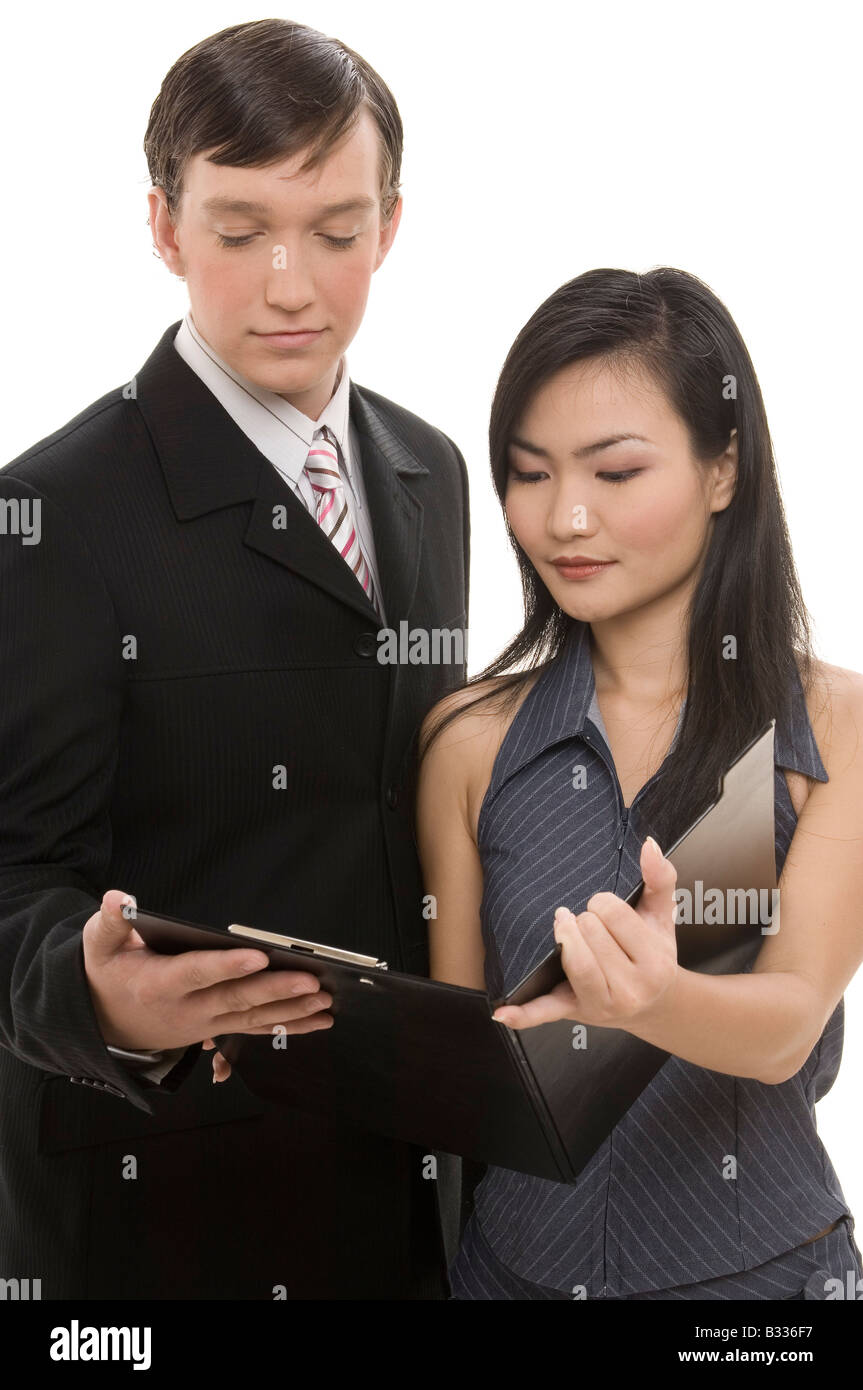 A businessman and businesswoman look over a document Stock Photo - Alamy