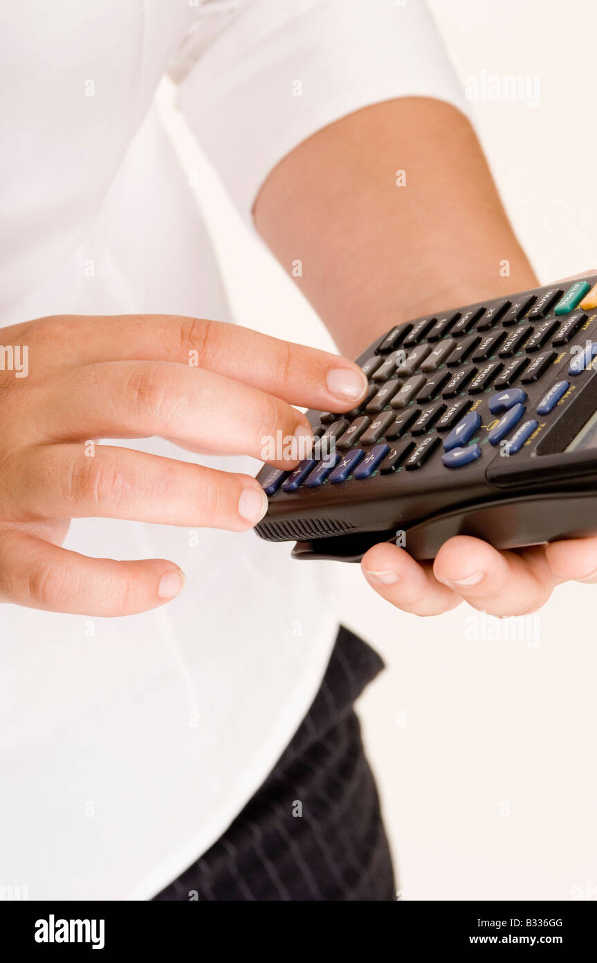 A young woman uses a graphical calculator Stock Photo - Alamy