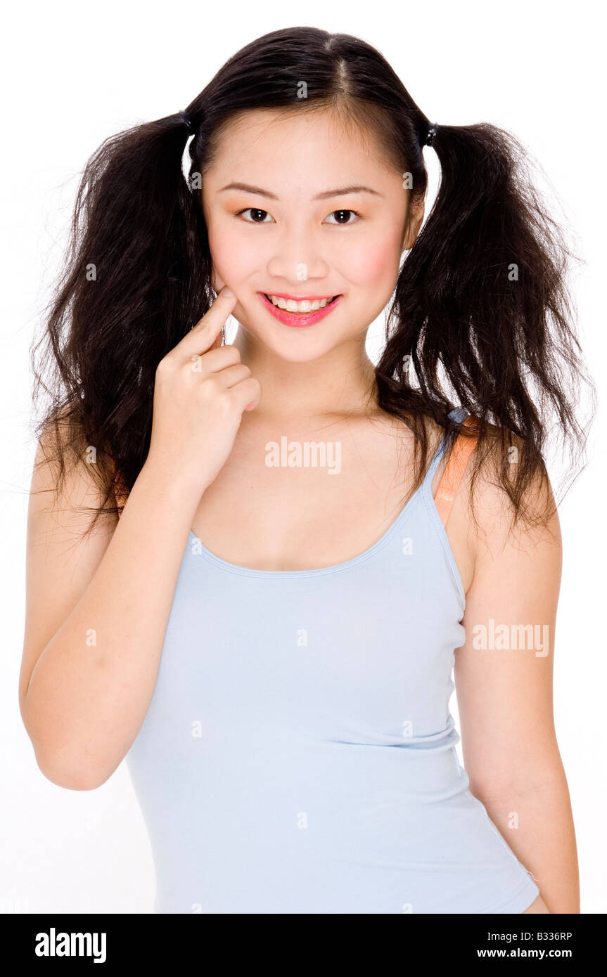 A young asian woman in a cute pose Stock Photo - Alamy